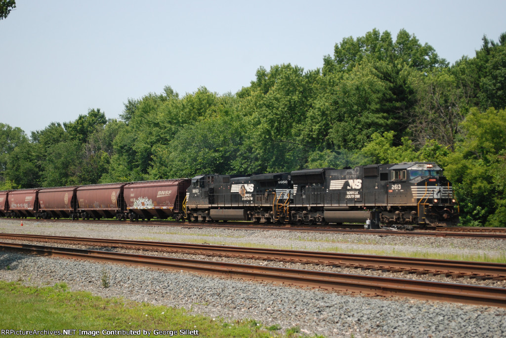 NS 2613 heads east with hoppers.